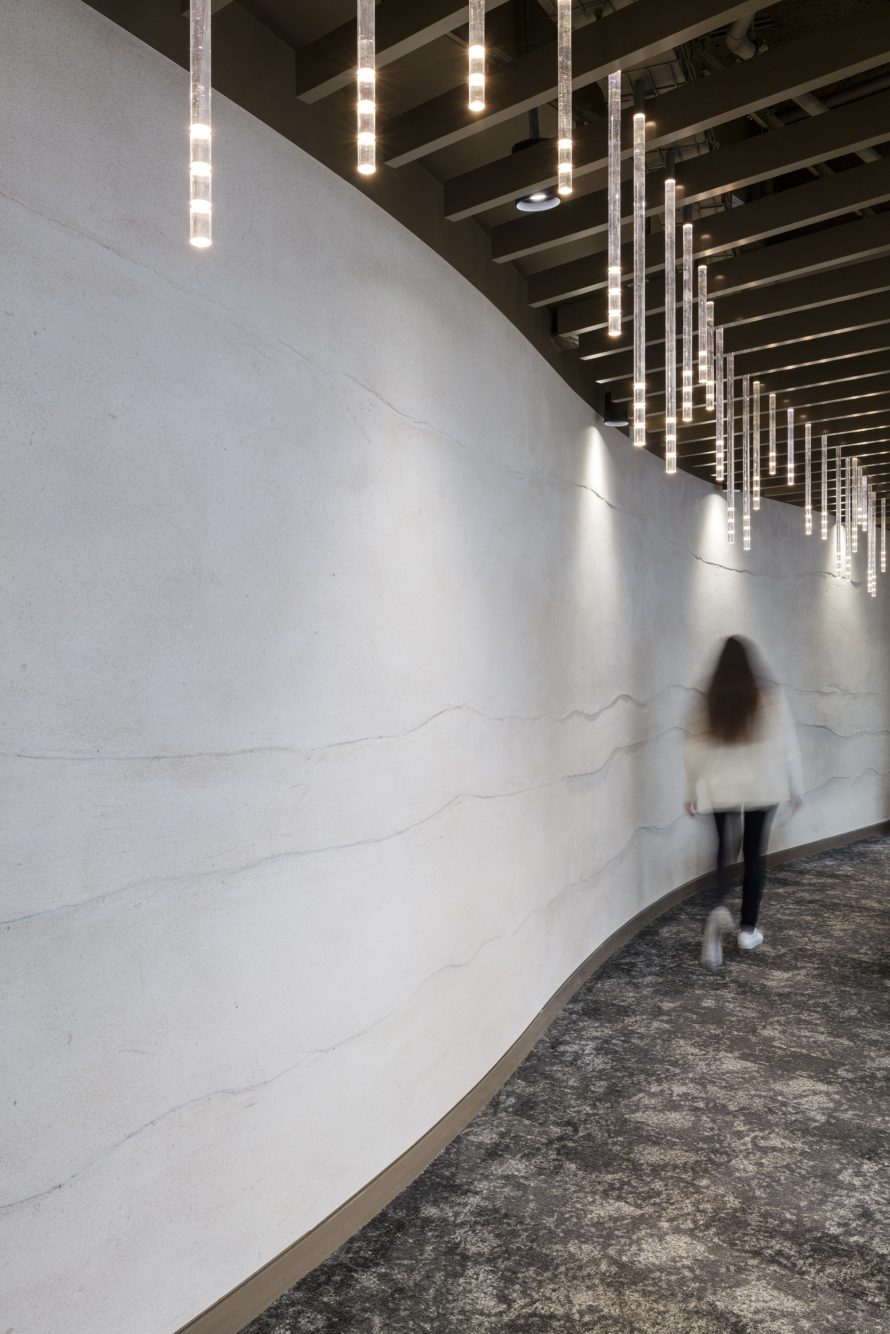 19 – Curved corridor walls with bespoke sand-ripple textures ...